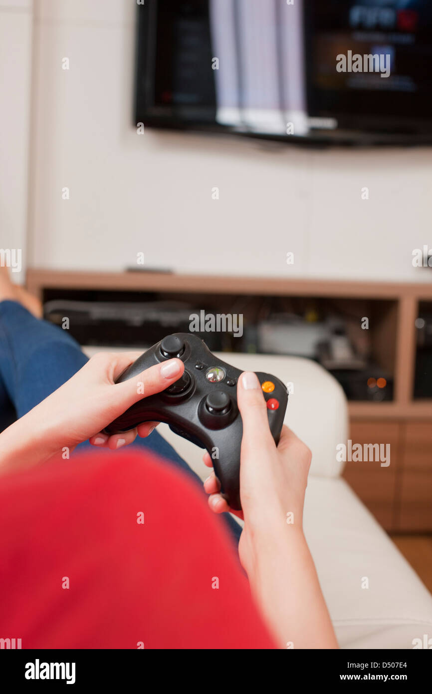 Blonde woman playing video games hi-res stock photography and images ...