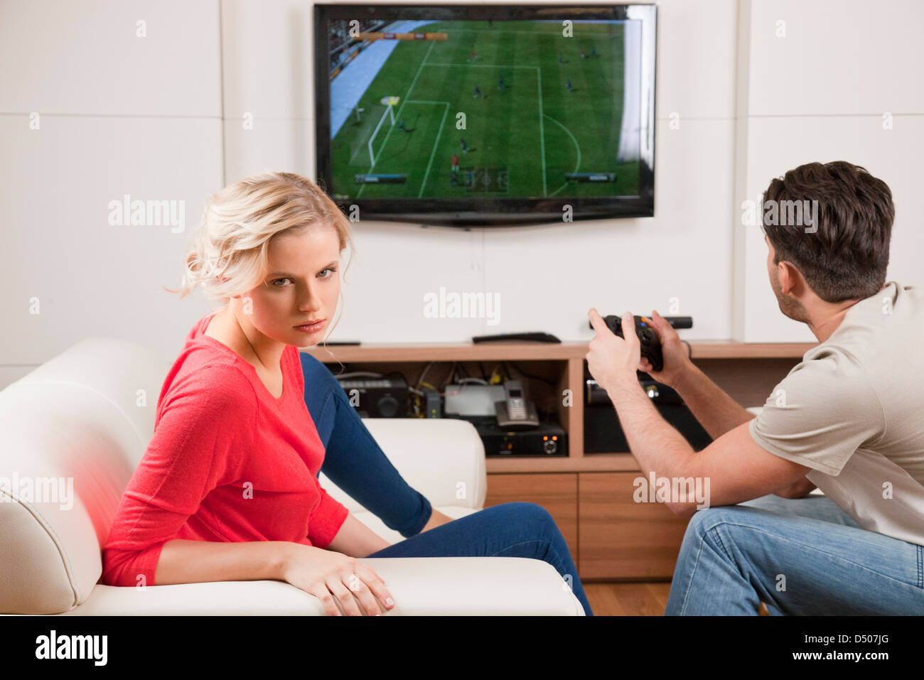 Man playing console game Stock Photo - Alamy