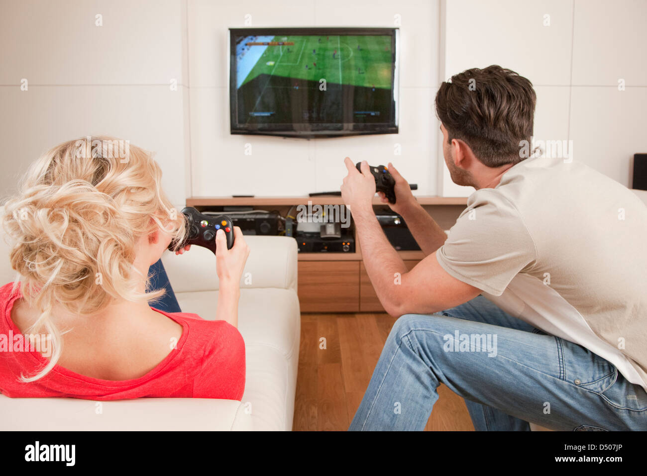 Boy girl playing console hi-res stock photography and images - Alamy