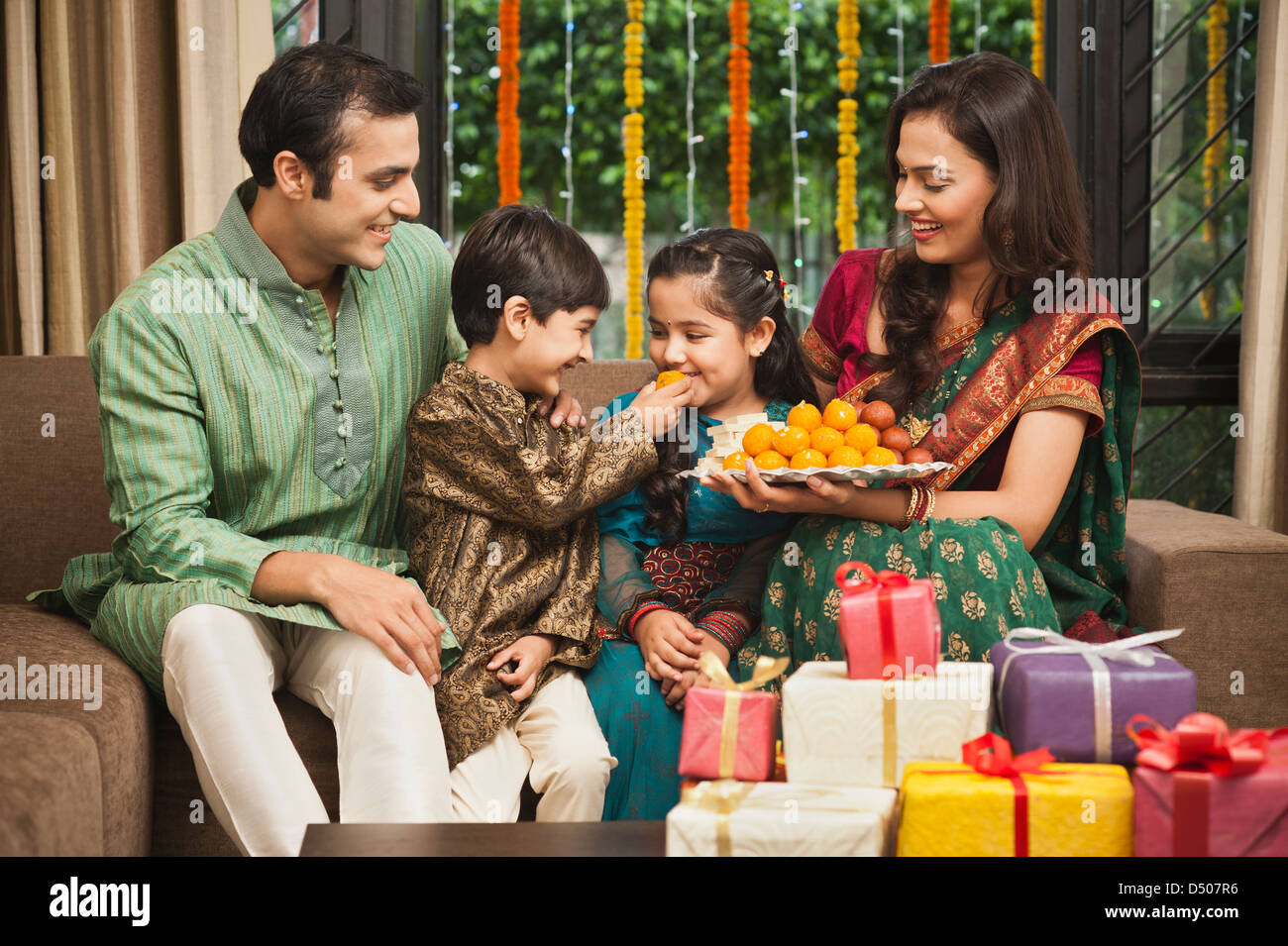 Family celebrating Diwali Stock Photo - Alamy