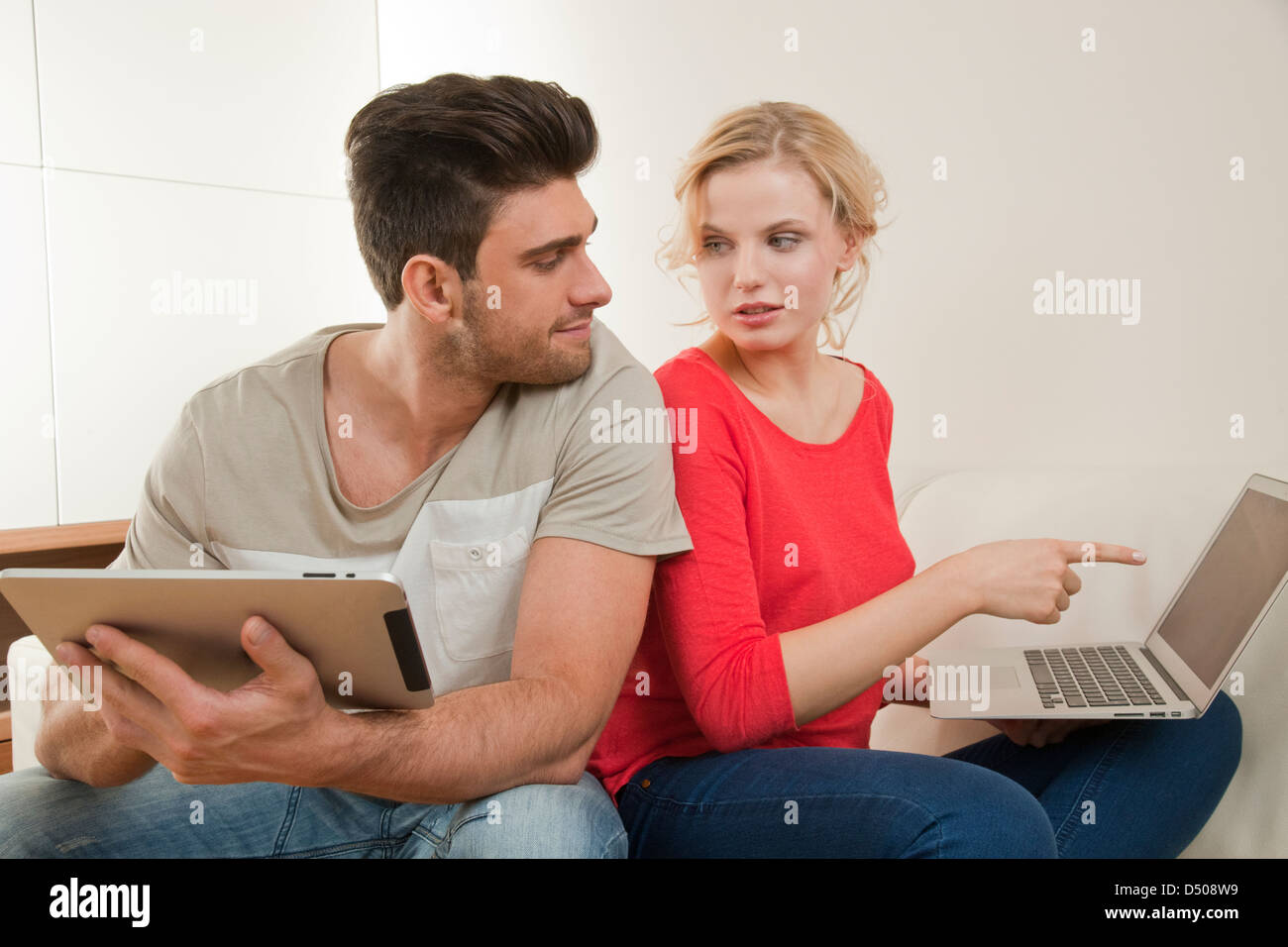 Couple using new technology Stock Photo - Alamy