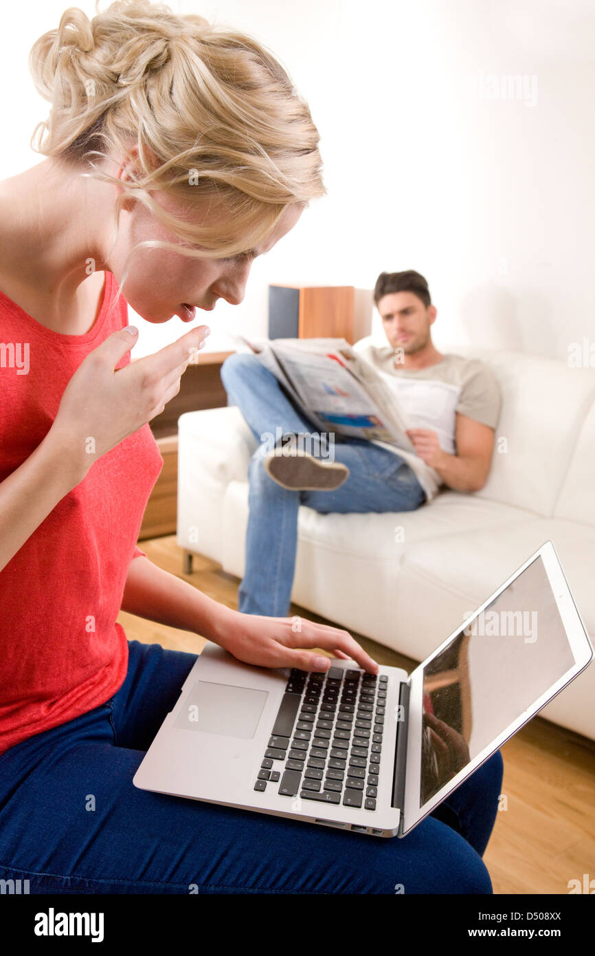 Woman using notebook Stock Photo - Alamy