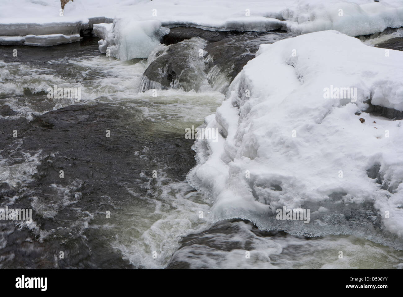 Partially frozen river Stock Photo - Alamy