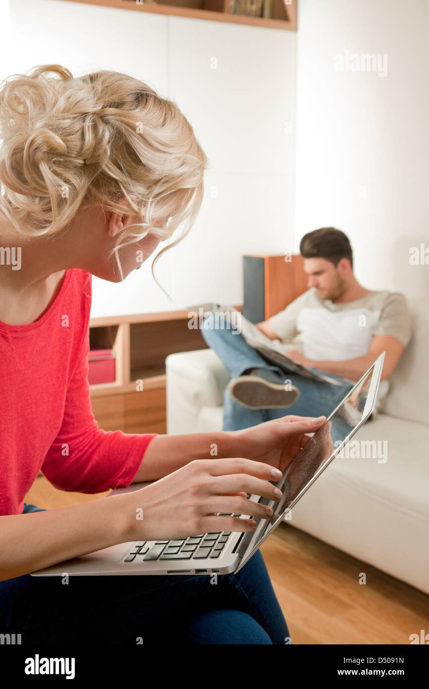 Woman using notebook Stock Photo - Alamy