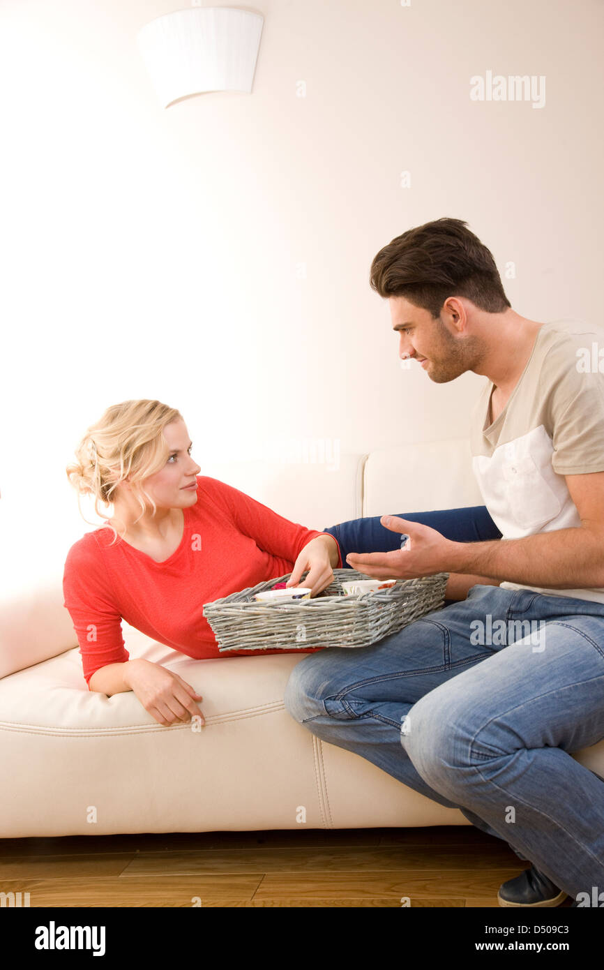 Man serving tea to woman Stock Photo - Alamy