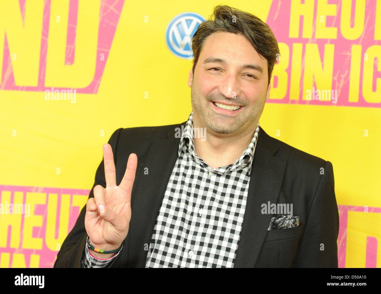 DJ Mousse T. poses for photographs as he arrives for the premiere of ...