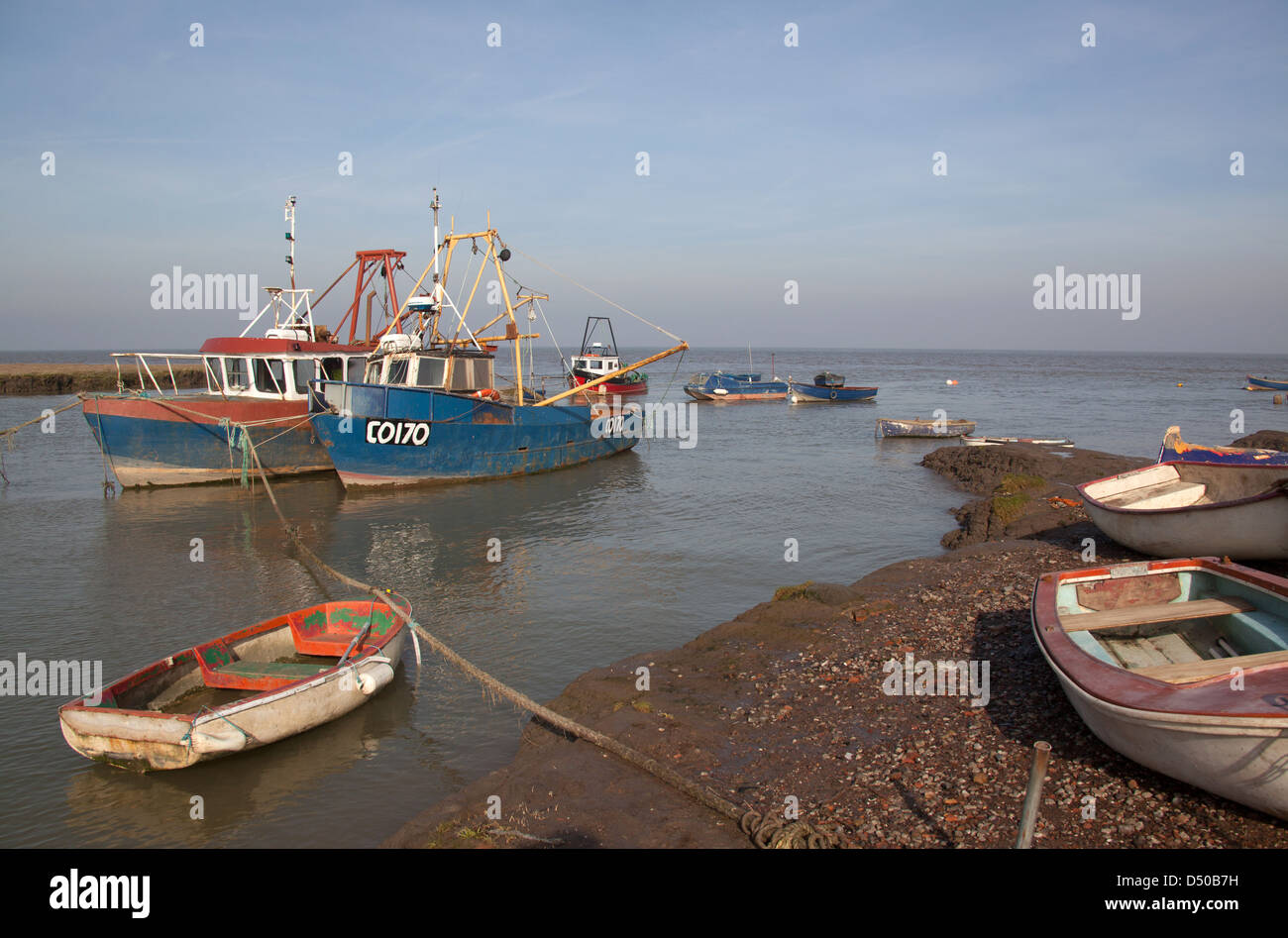 The Wales Coastal Path in North Wales. Fishing boats moored in a small ...
