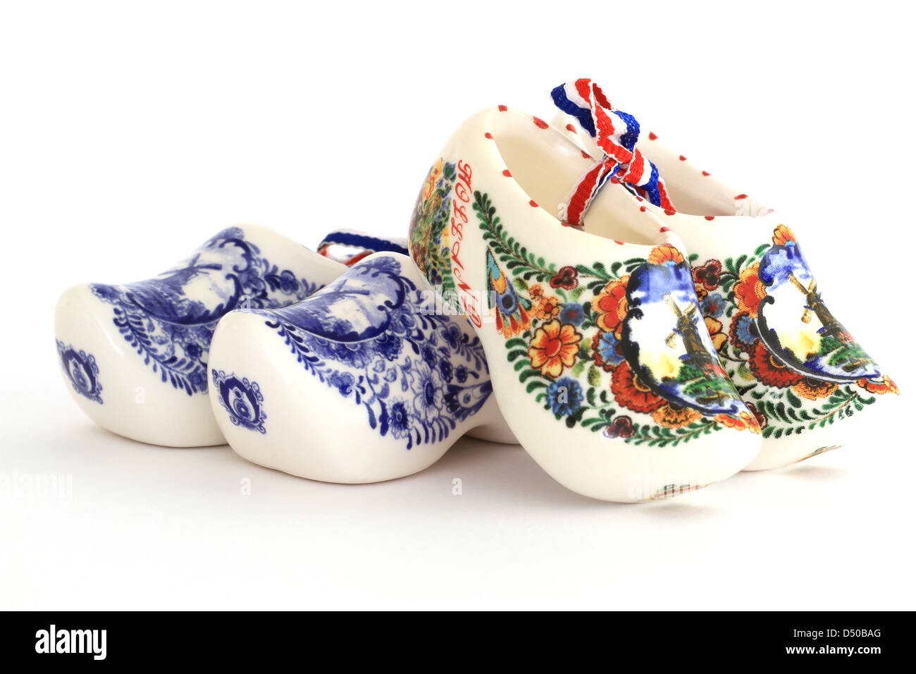 Dutch porcelain clogs on white background Stock Photo - Alamy