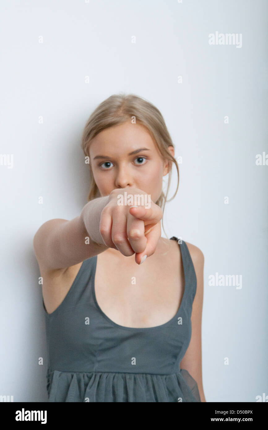 Teenage girl pointing at camera Stock Photo - Alamy
