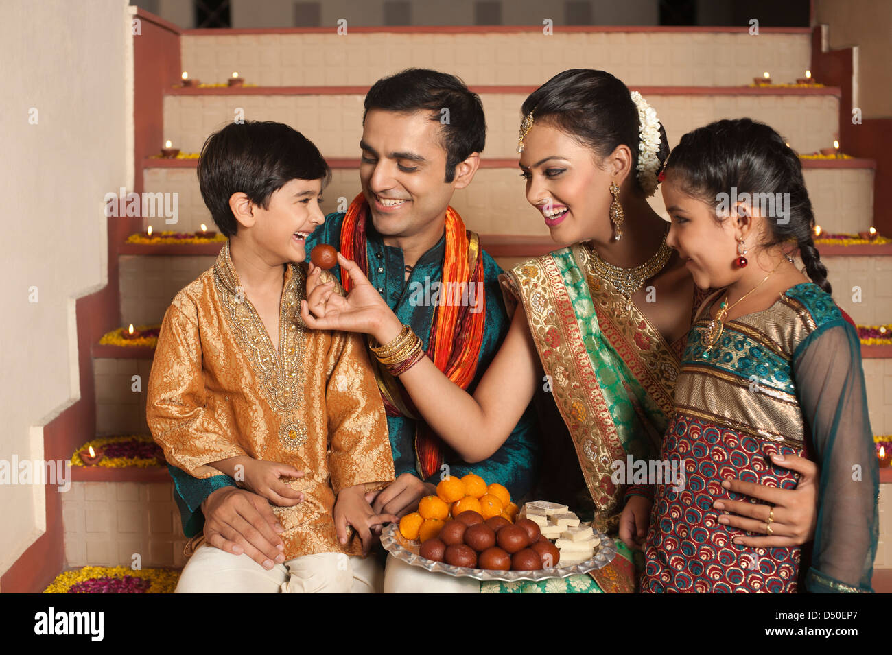 Family celebrating Diwali Stock Photo - Alamy