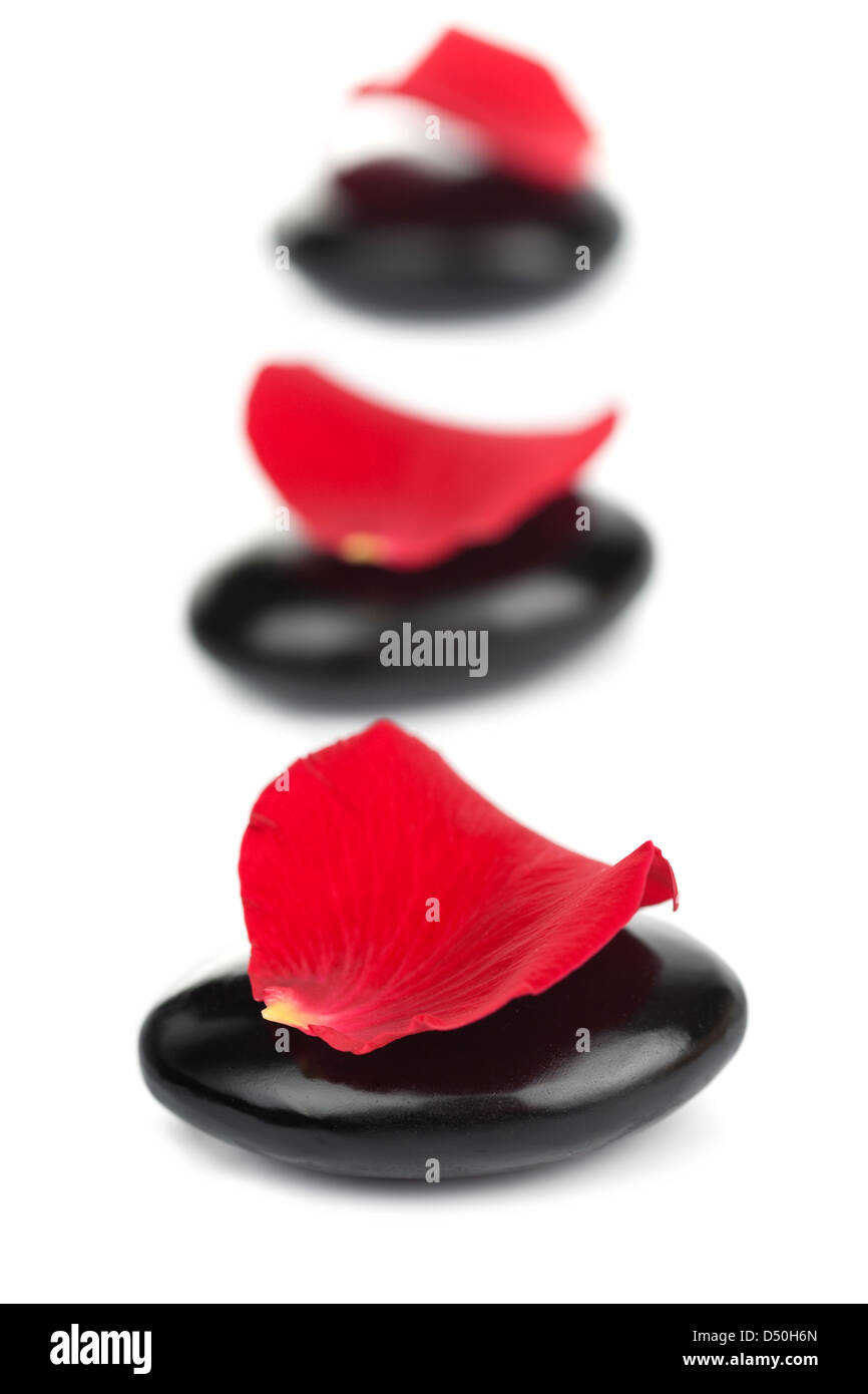 spa stones and red rose petals isolated Stock Photo - Alamy