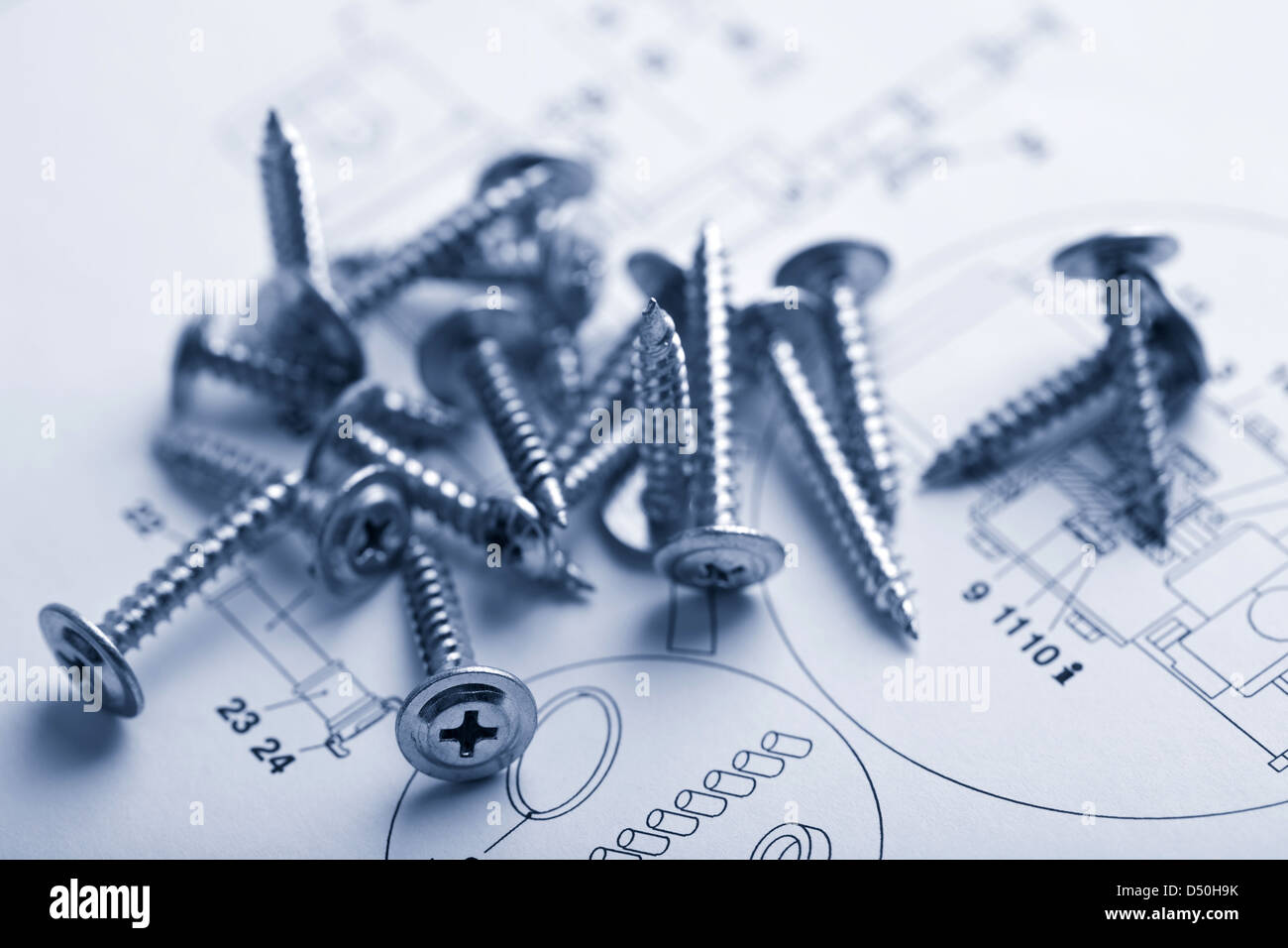 metal screws over technical drawing Stock Photo - Alamy
