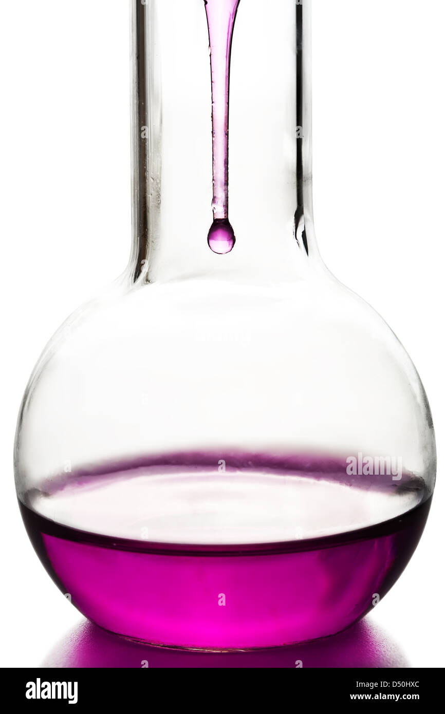 liquid dripping from pipette into flask isolated Stock Photo - Alamy