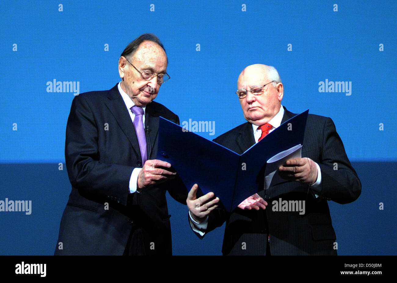 Former soviet head of state and head of party Mikhail Gorbachev (R) is ...