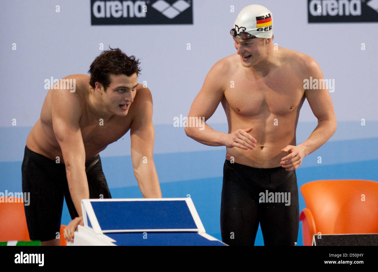 German swimmers and brothers Steffen (R) and Markus Deibler cheer after their second place in ...