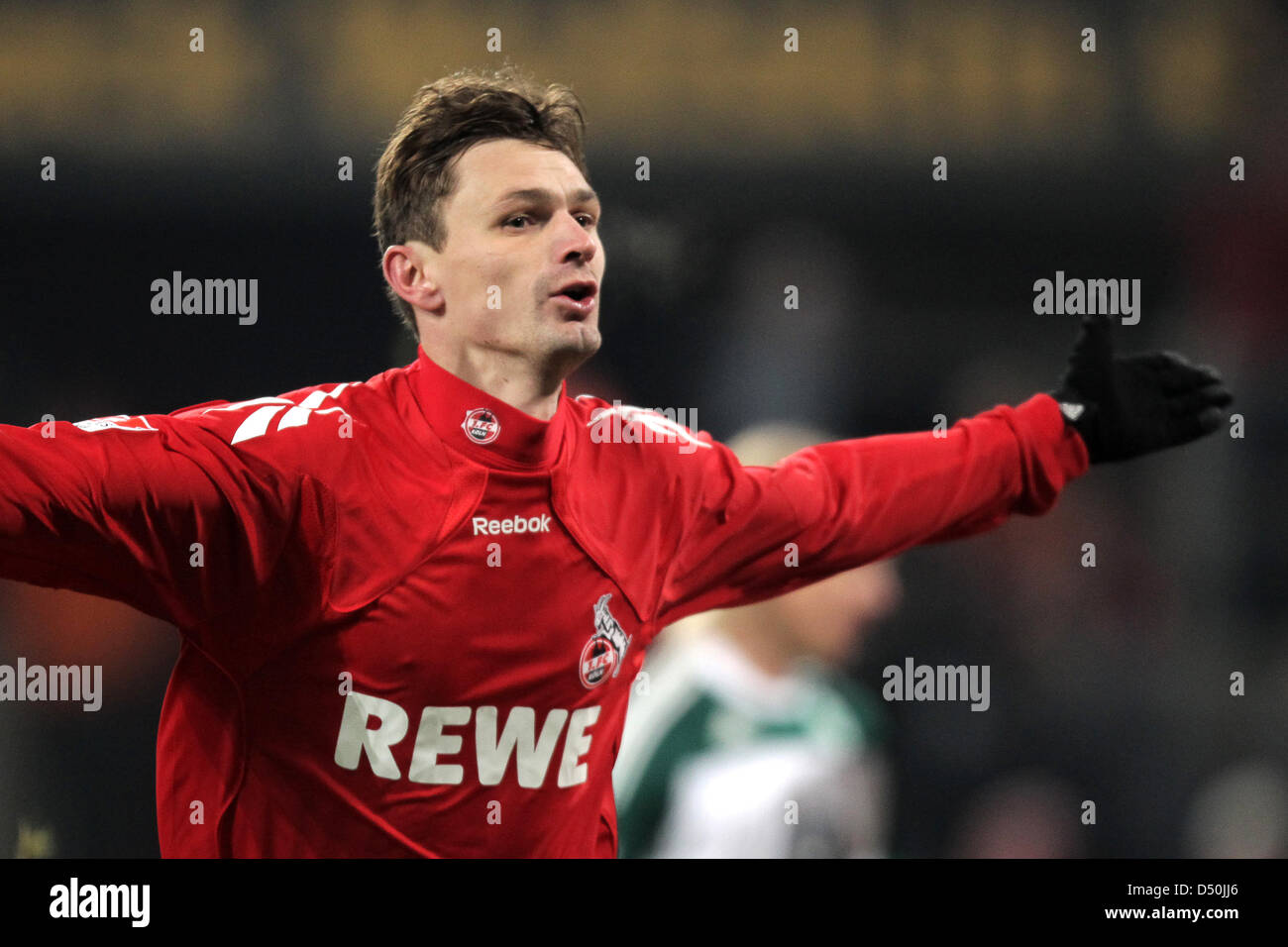 Cologne's Milivoje Novakovic cheers after his 1-0 goal during a German ...
