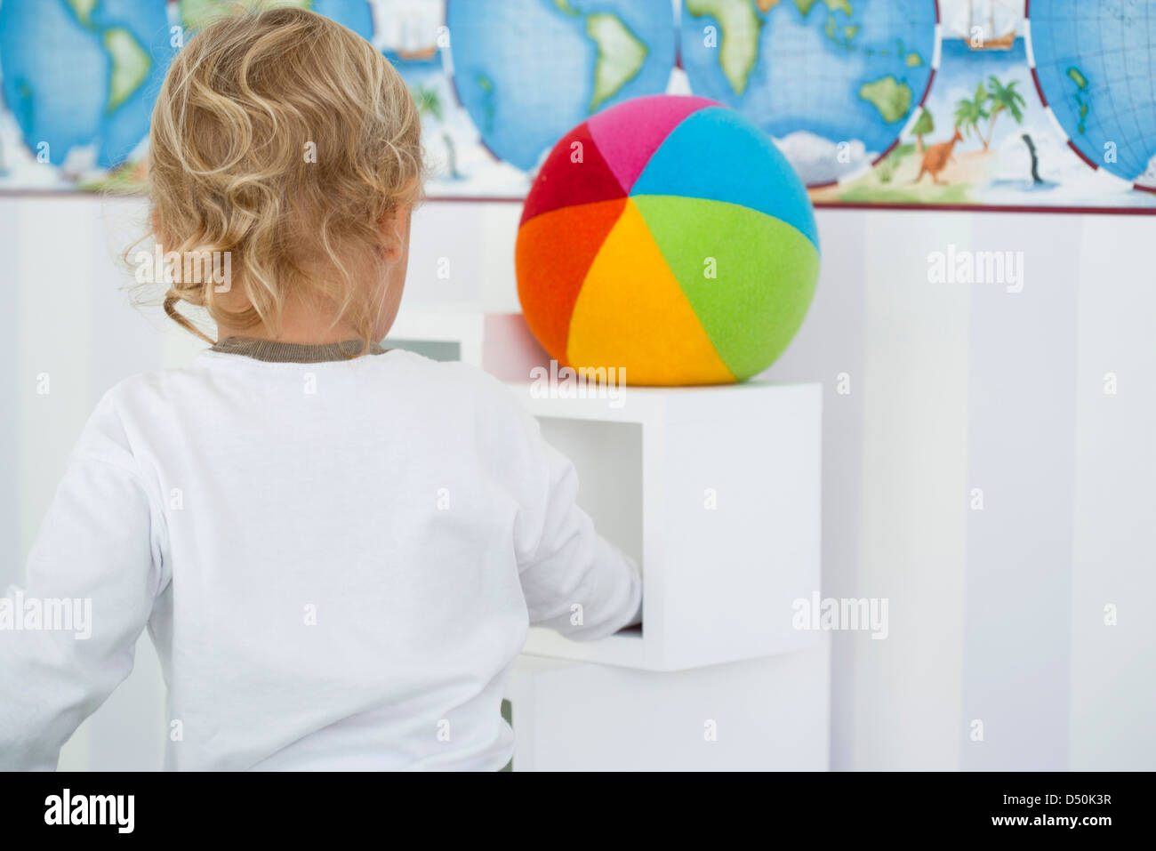 Baby playing in nursery, rear view Stock Photo - Alamy