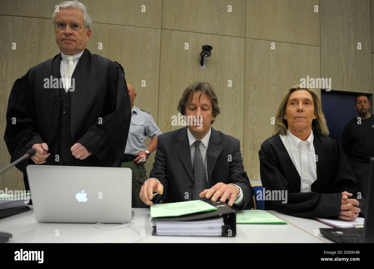 Weather presenter Joerg Kachelmann (C) sits next to his new lawyer ...
