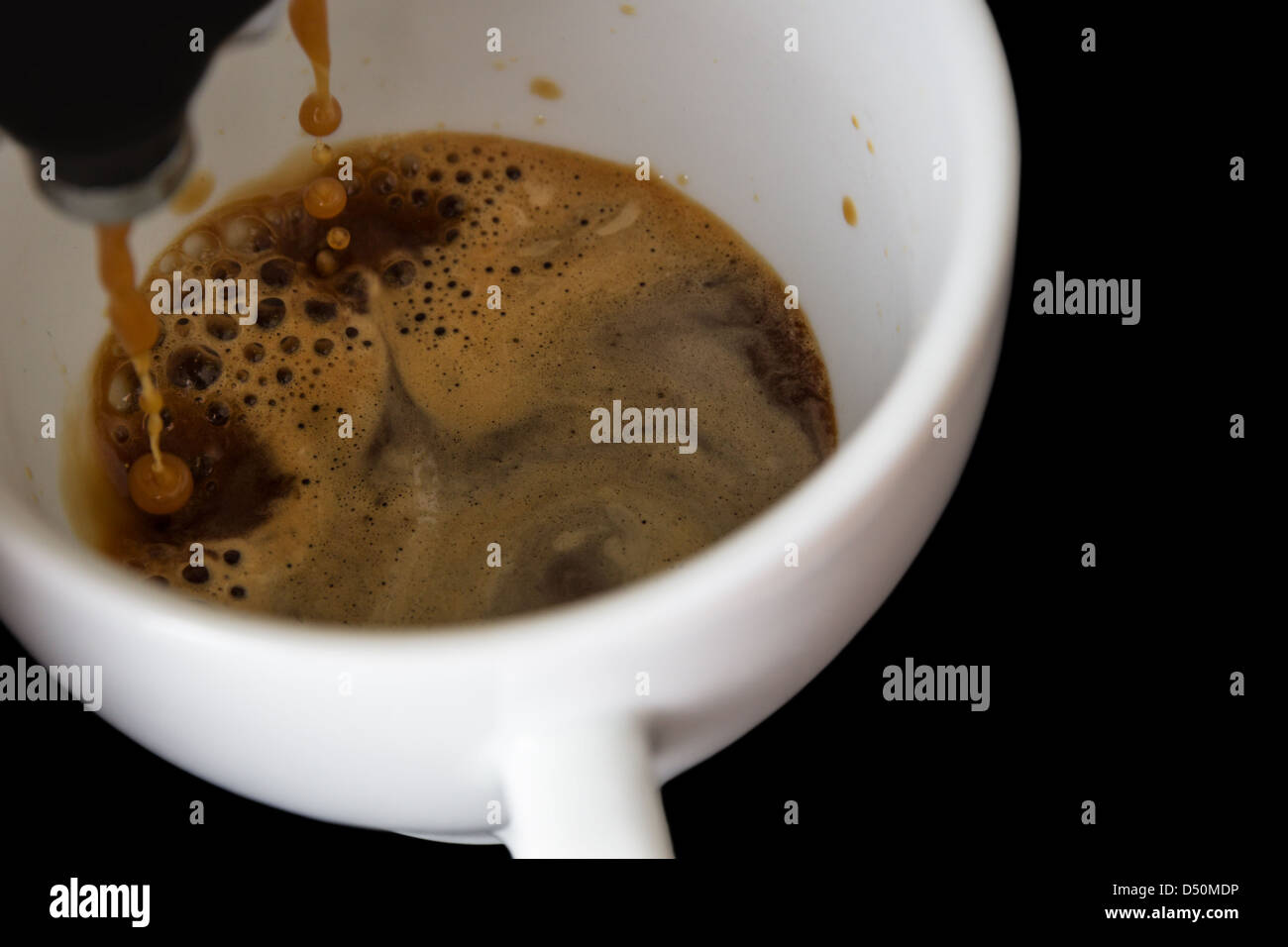 making a cup of coffee, black background Stock Photo - Alamy