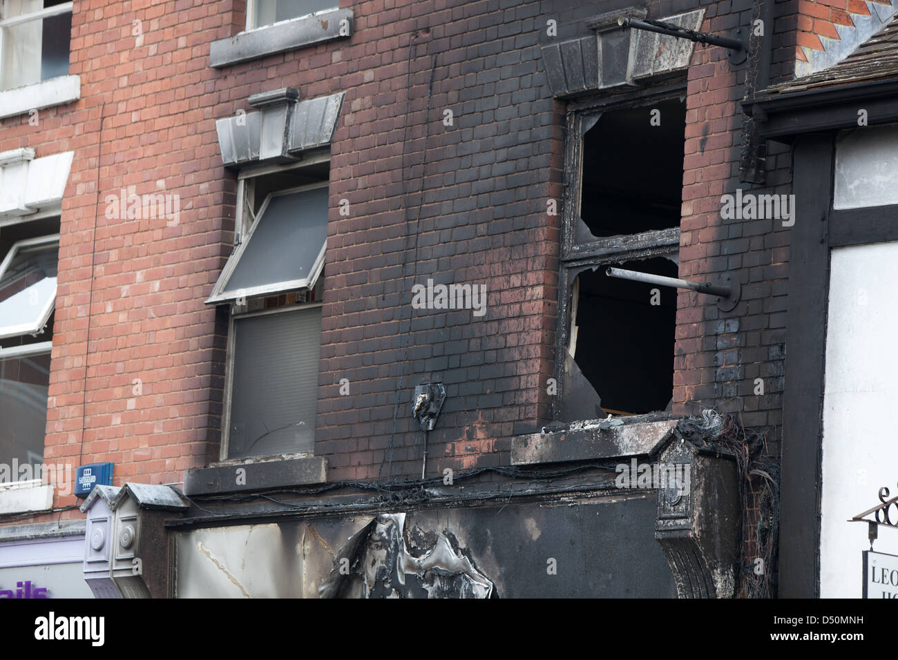 A fire blackened building after a severe fire. Upper floor windows ...