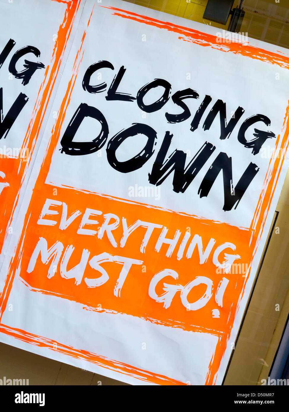 Closing Down Everything Must Go sign in a shop window indicating the ...