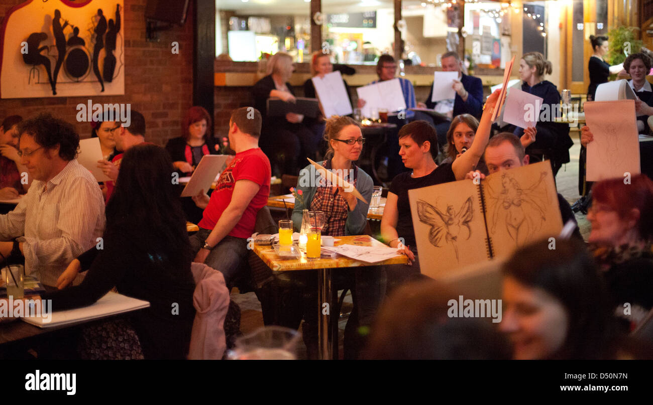 Group of people at a Dr Sketchy burlesque life drawing class held in a ...