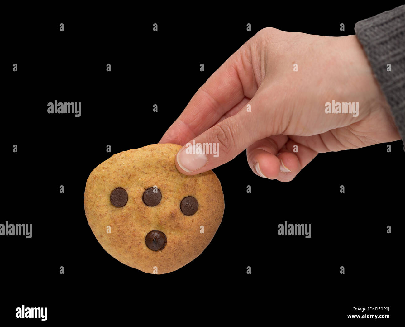 Pumpkin cookie and hand Stock Photo - Alamy