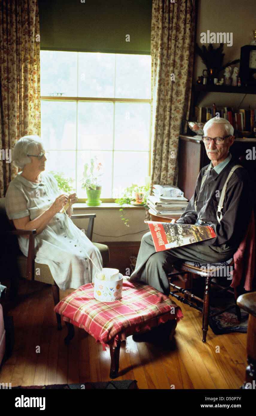 Senior Farm Couple sitting by window of their farm house Stock Photo ...