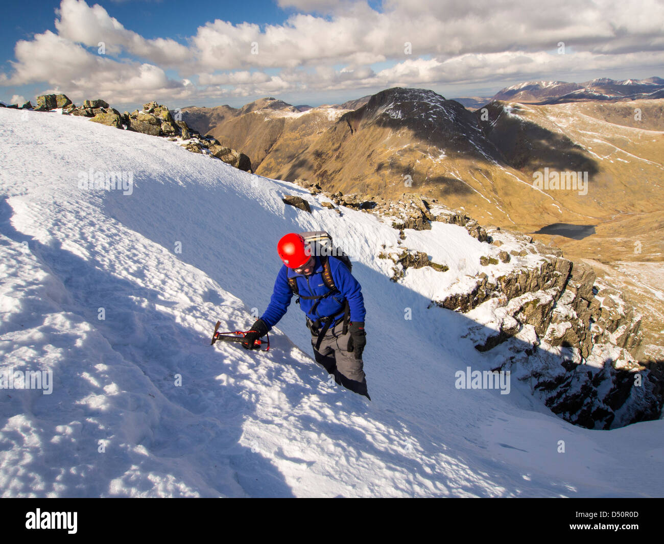 A winter climber in Custs gully on Great End, Lake District, UK Stock ...