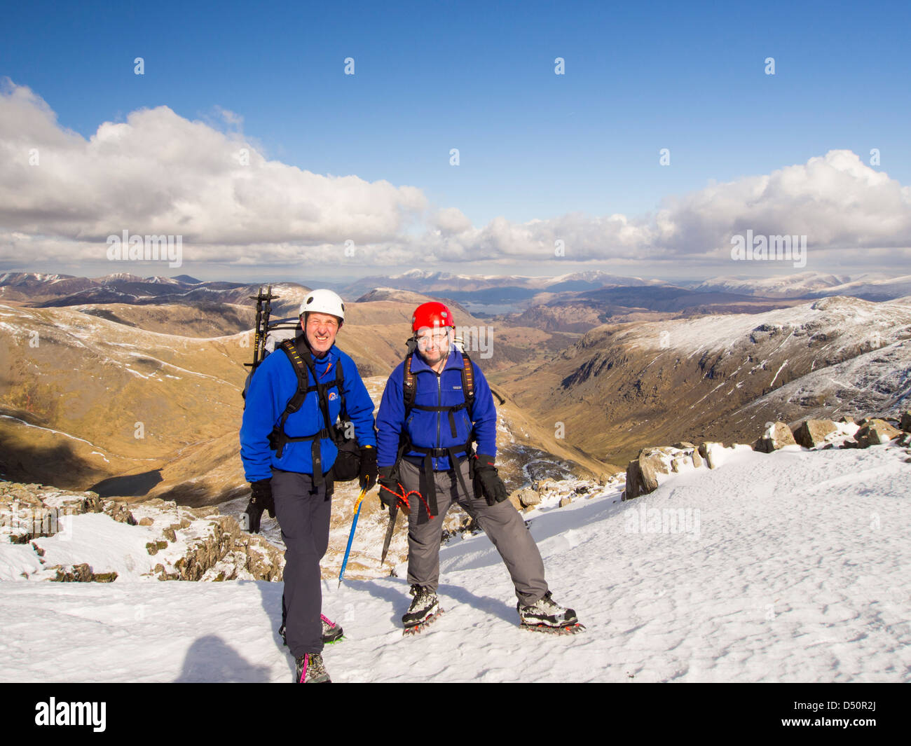 Two climbers having just topped out in Custs Gully on Great End, a ...