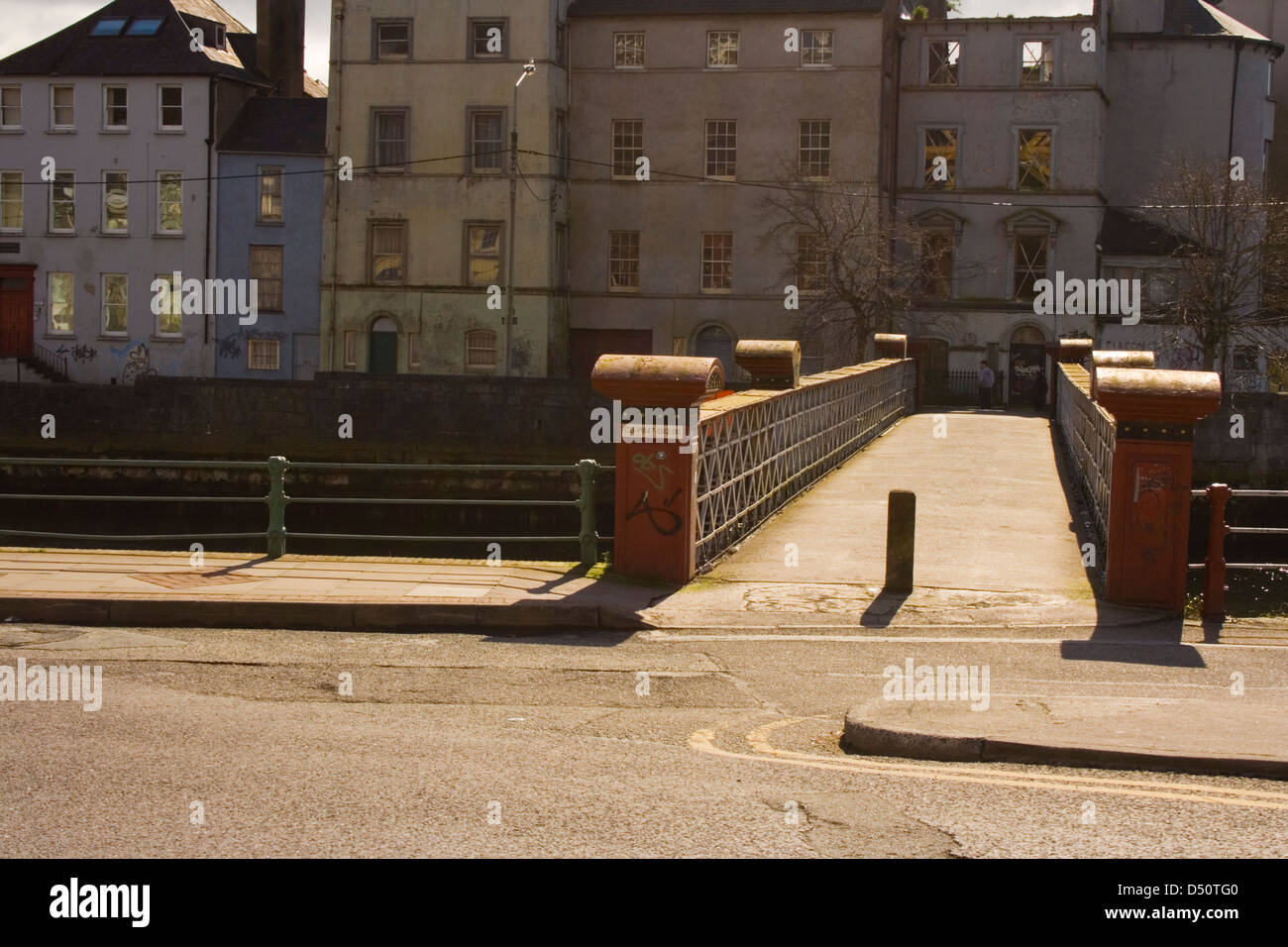 Bridge in Cork City overlooked by derelict buildings Stock Photo - Alamy