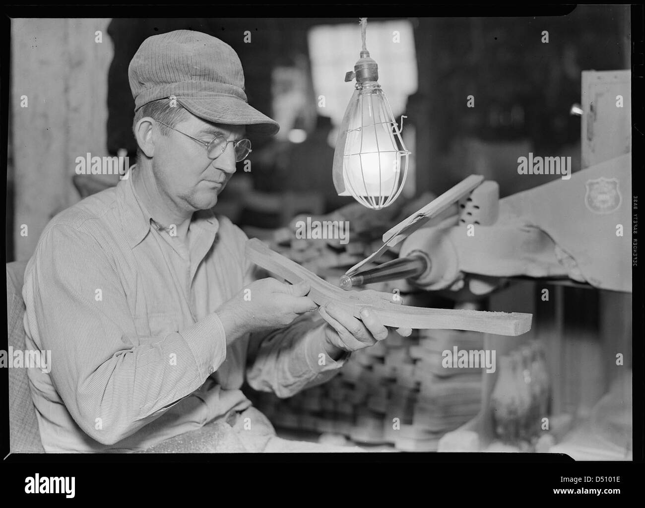 A detailed view of a spindle carver working on the top-back of a chair ...
