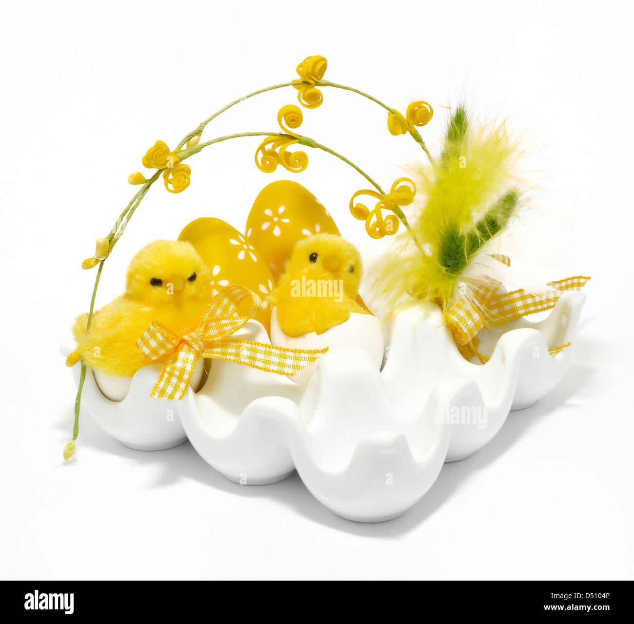Easter decoration with eggs and small chickens on a white background ...