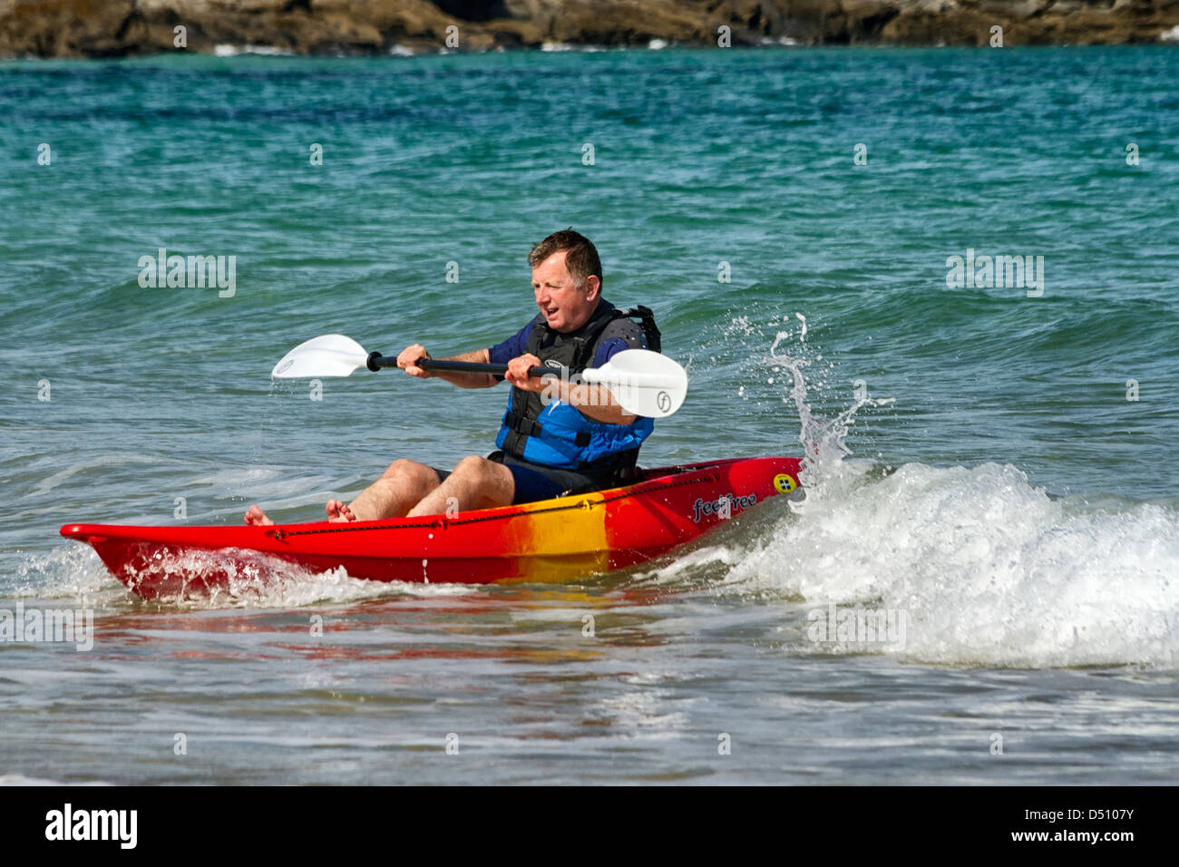 Mature man with a canoe, Harlyn Bay, Cornwall, England Stock Photo - Alamy