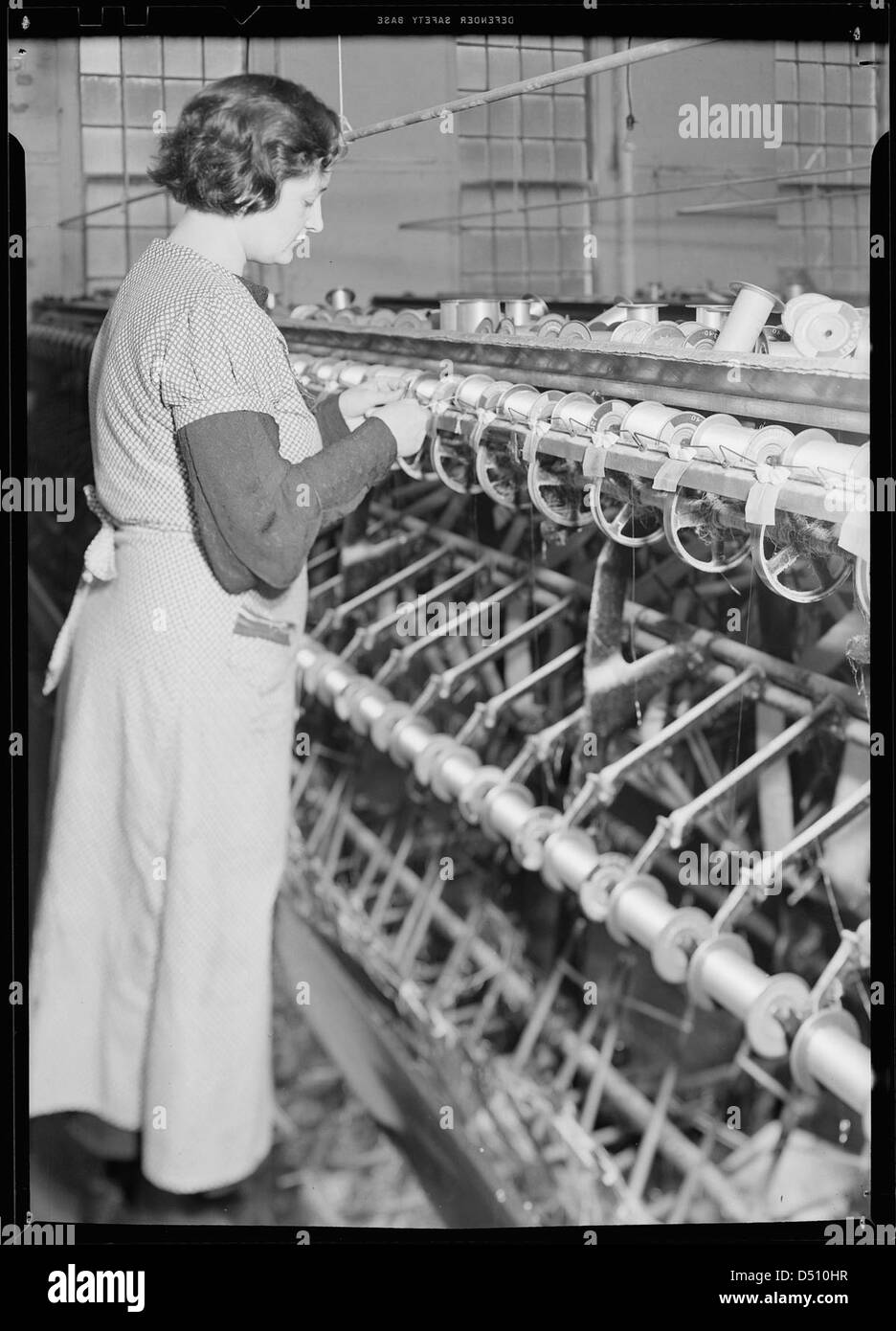 1930s factory worker operates machine hi-res stock photography and ...