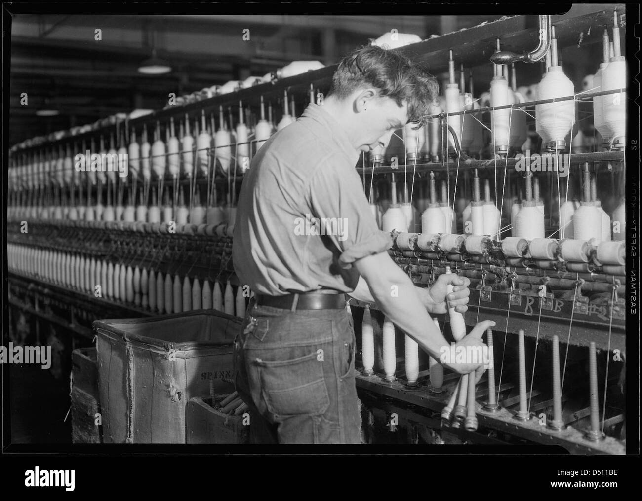 Man fixing machine Black and White Stock Photos & Images - Alamy