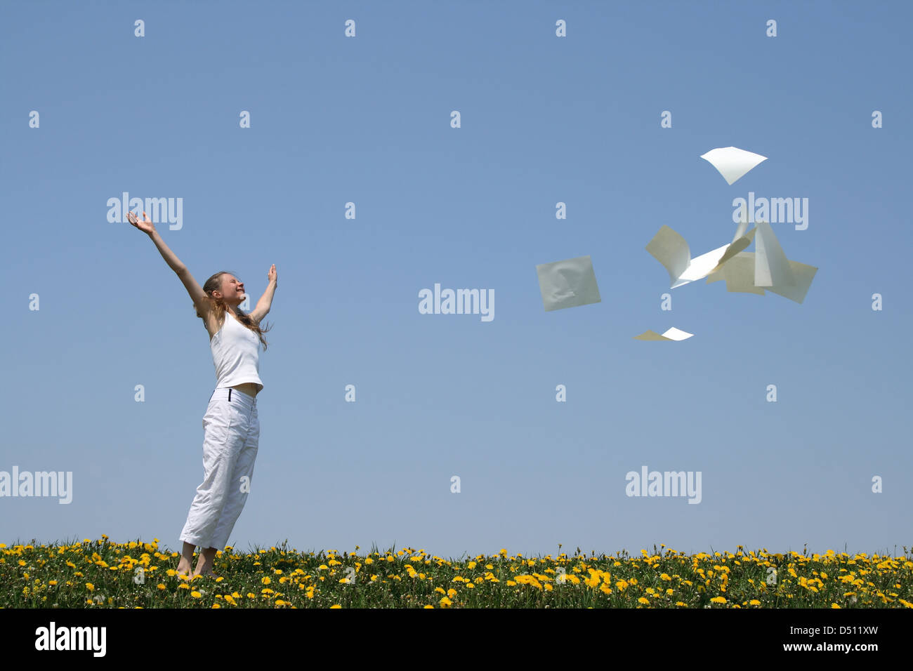 Laughing girl throws in air blank paper sheets (with copy space ...