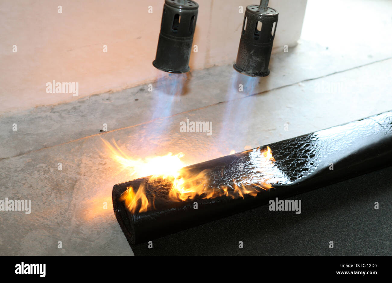 New Kätwin, Germany, tar paper is warmed up with a gas heating torch ...