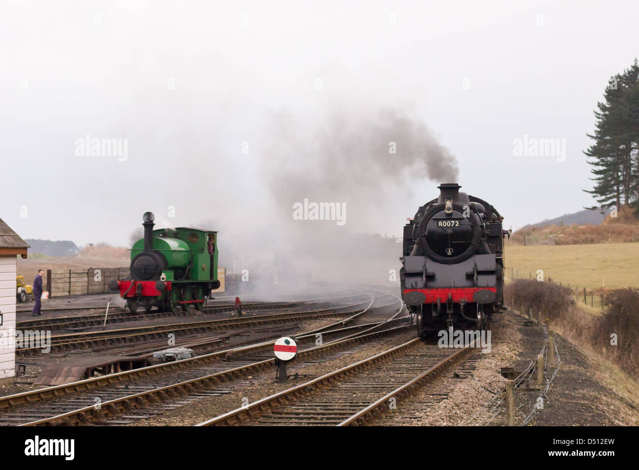 A steam locomotive pulling a passenger train on the North Norfolk ...