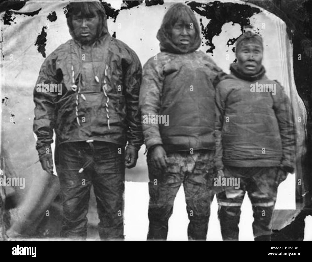 This photograph, taken in 1854, depicts an elderly Inuit woman and two ...