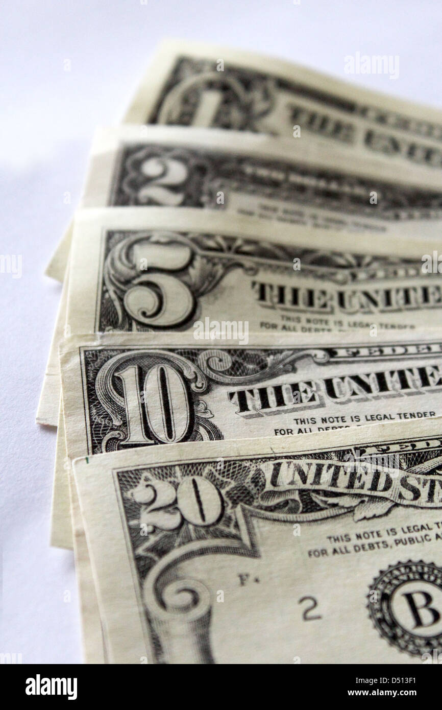 Some dollar banknotes isolated on a white background Stock Photo - Alamy