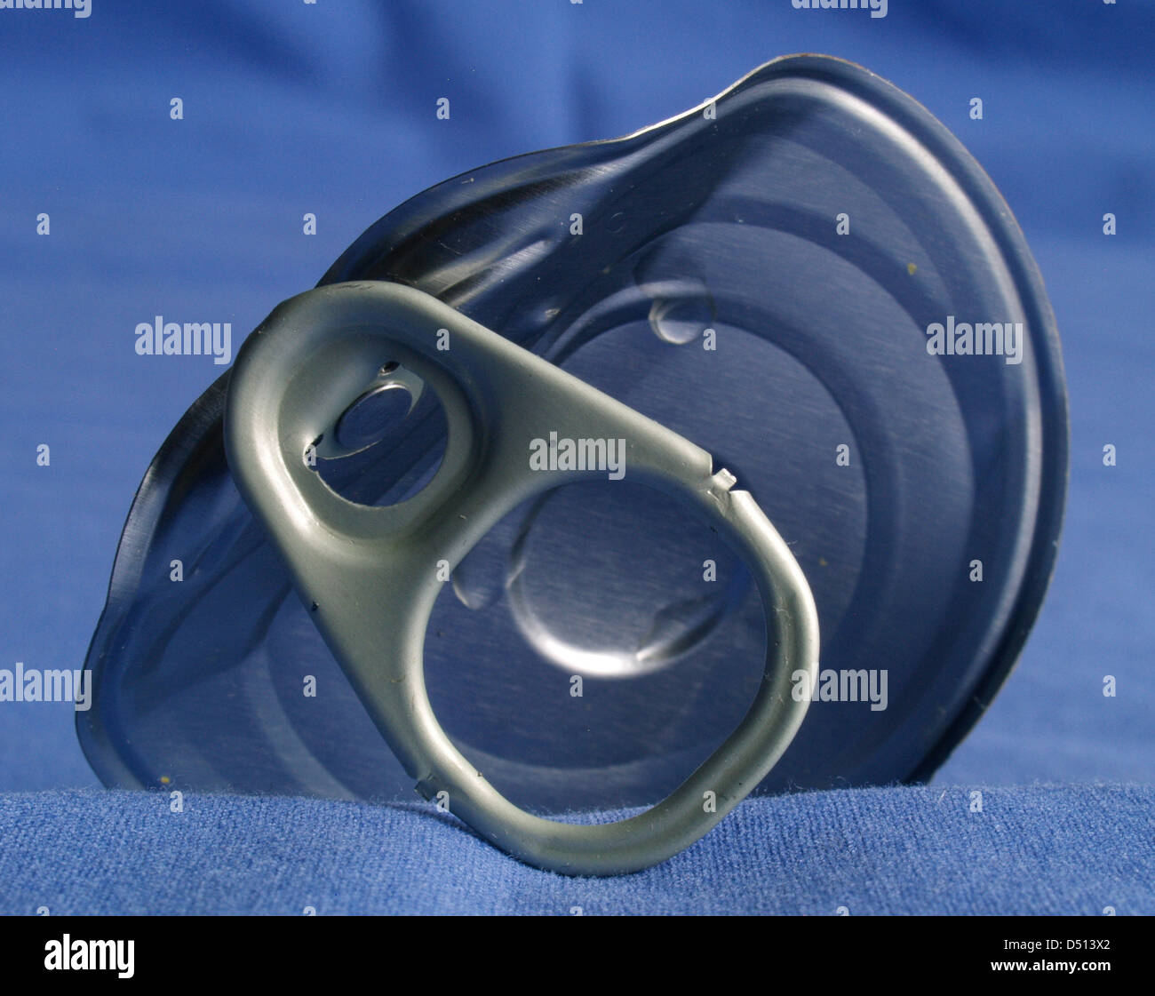 Ring pull lid off of a food can Stock Photo - Alamy
