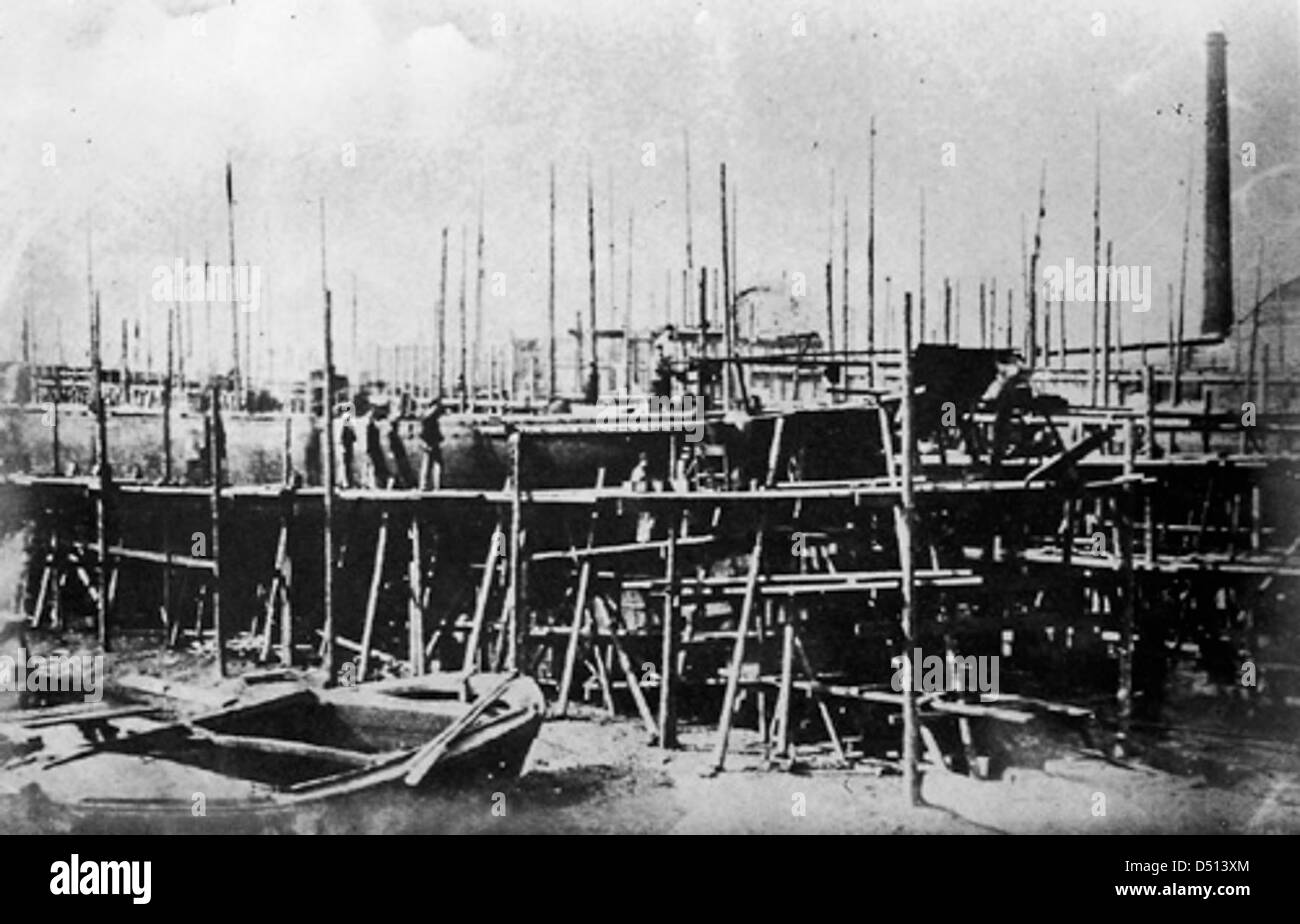 This photograph shows a ship under construction at the James Ash and ...