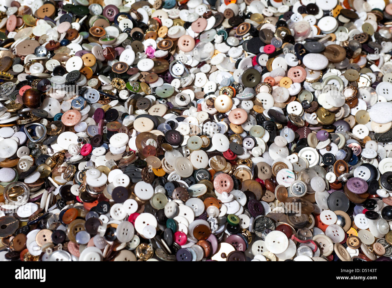 many buttons in bin Stock Photo - Alamy