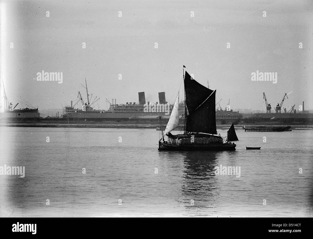 This image captures a Thames barge sailing off Tilbury, showcasing ...