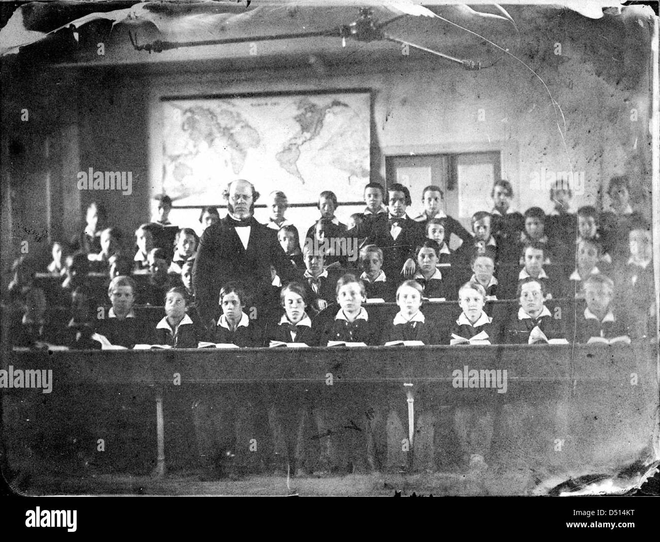 This image shows Mr. John Riddle, the headmaster, with his pupils at ...
