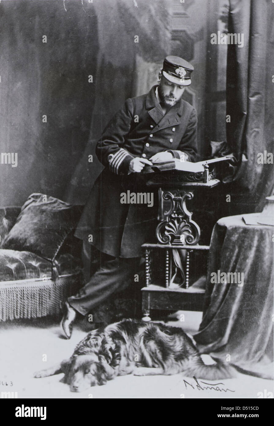 Captain Erskine of HMS 'Eclipse' poses with his collie dog. The image ...