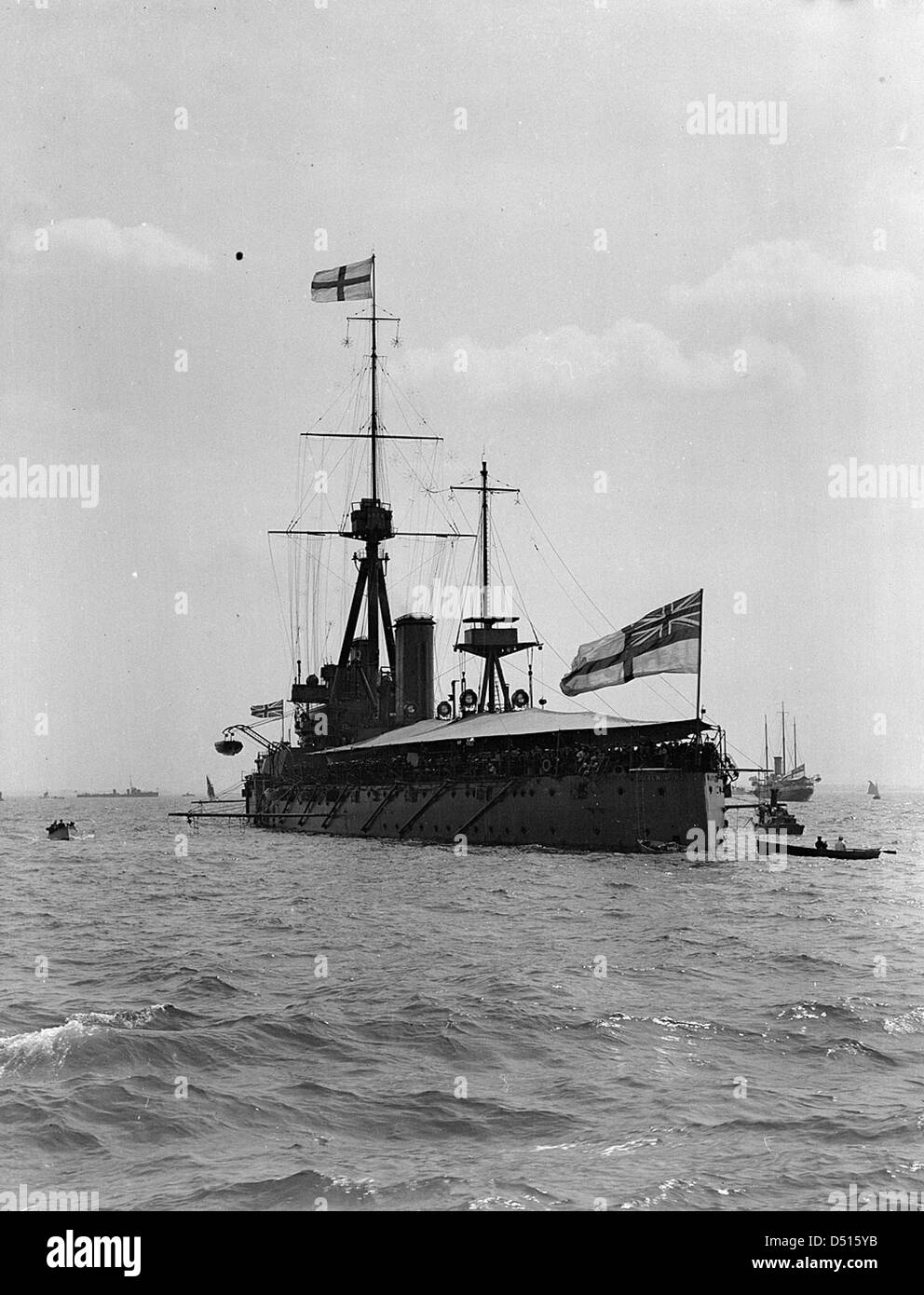This photograph shows HMS 'Dreadnought', a British battleship, anchored ...