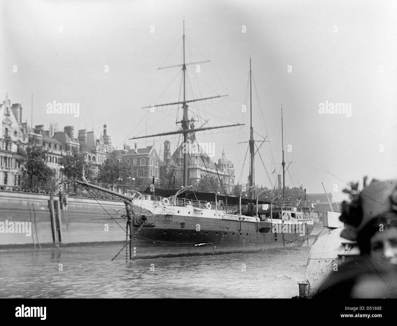 The RNVR Training Ship 'Buzzard' is docked along the River Thames at ...