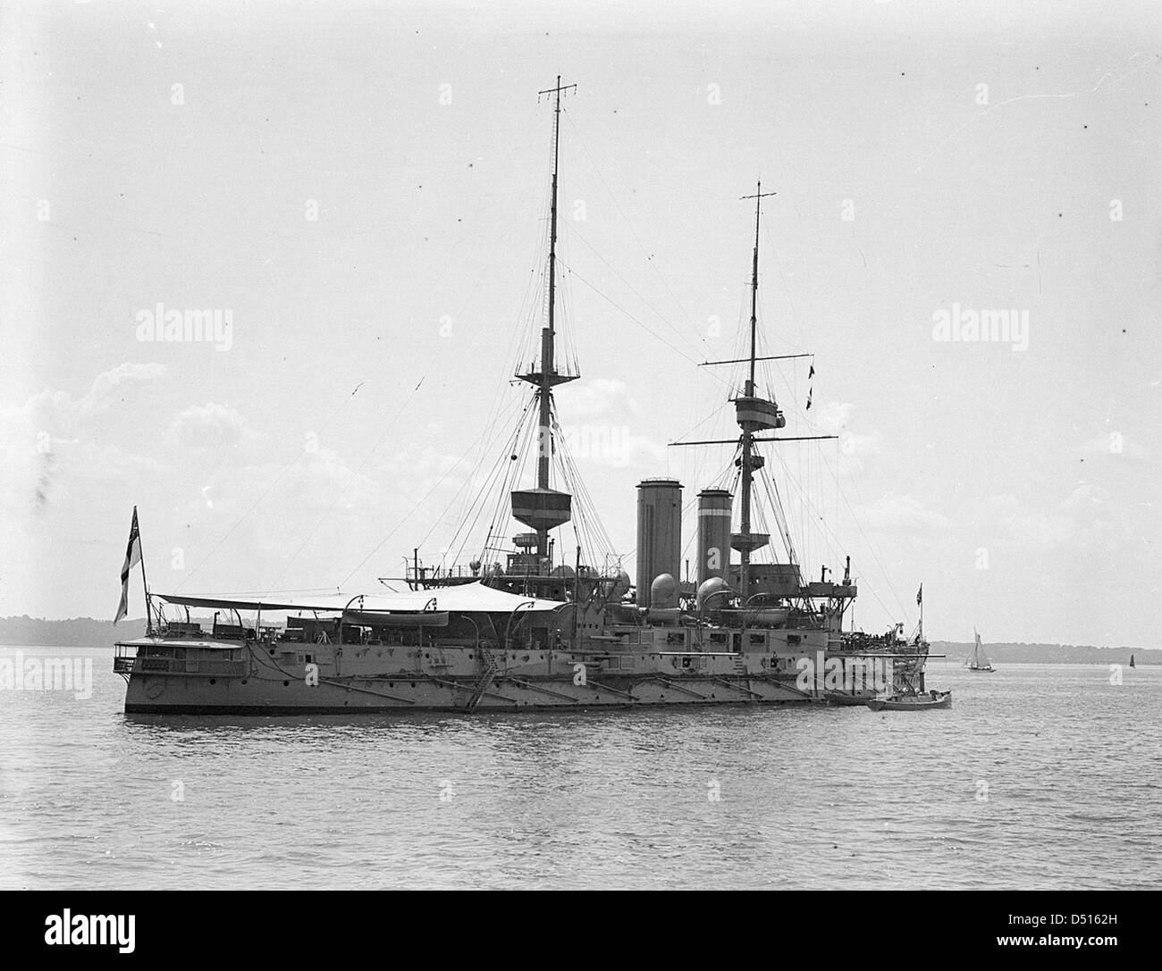 This photograph shows the Royal Navy battleship HMS 'Implacable ...